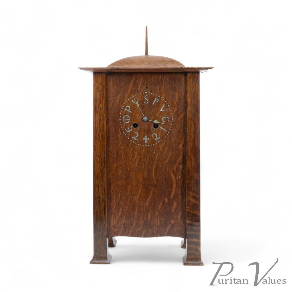 C. F. A. Voysey (1857–1941). A rare Arts and Crafts oak mantel clock ...